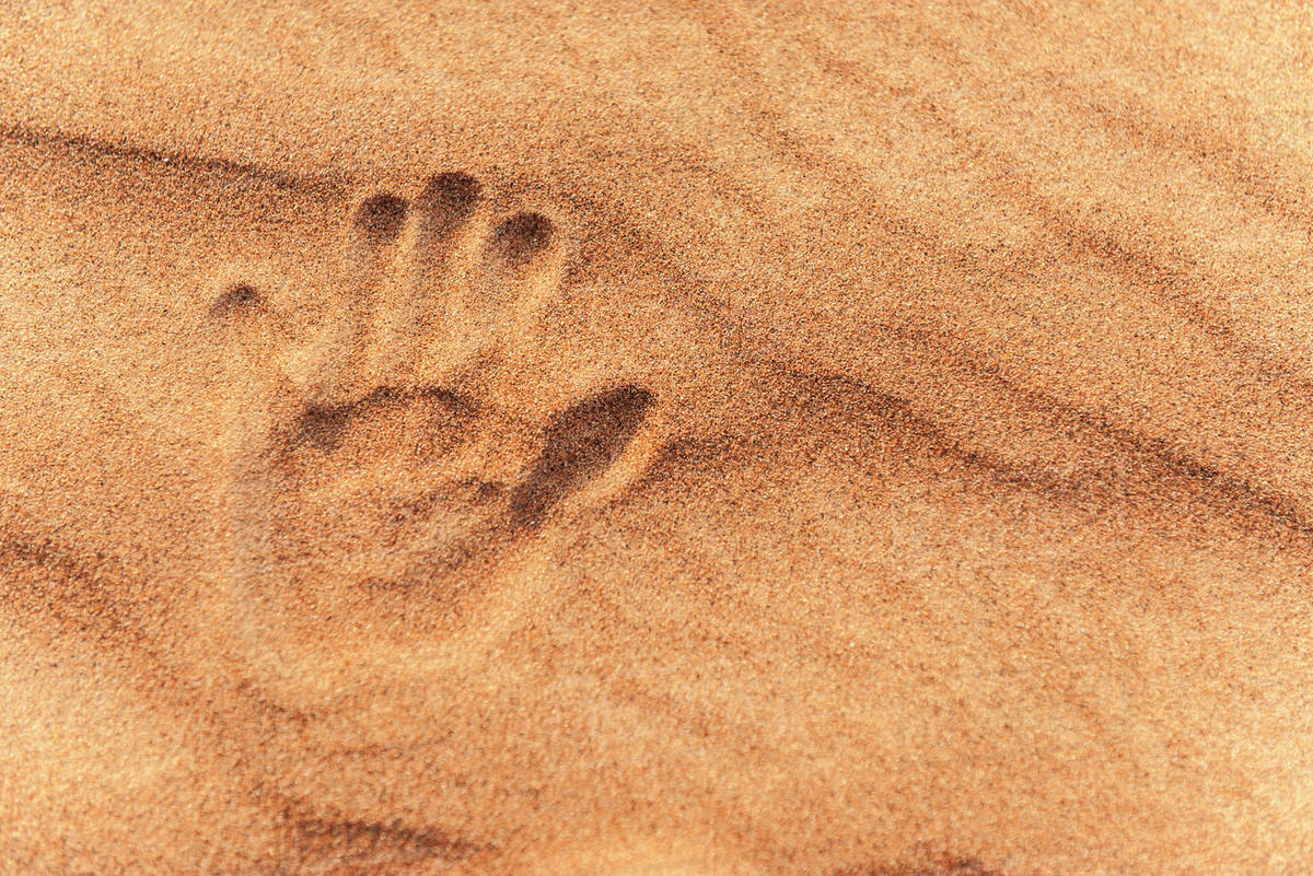 Handprint in sand - Royalty-free Stock Photo | Dissolve