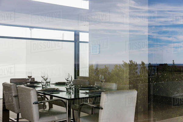 Modern dining room through window - Stock Photo - Dissolve