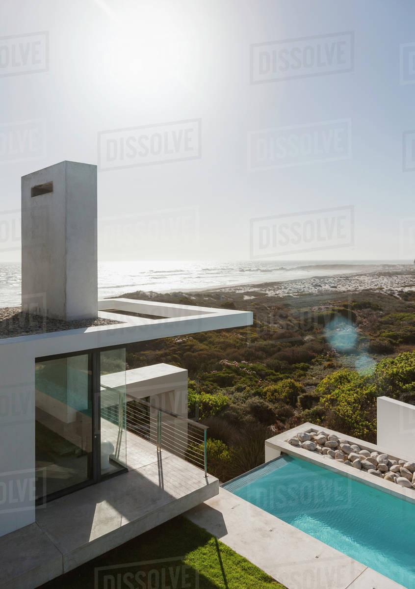 Modern house and lap pool overlooking ocean - Royalty-free Stock Photo ...