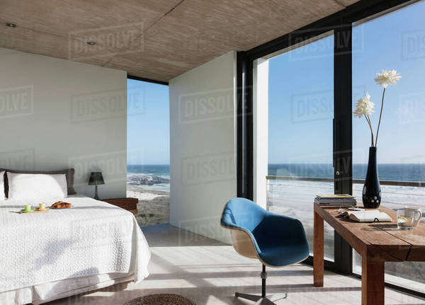 Modern bedroom overlooking ocean - Stock Photo - Dissolve