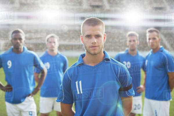 Soccer players standing on field - Royalty-free Stock Photo | Dissolve