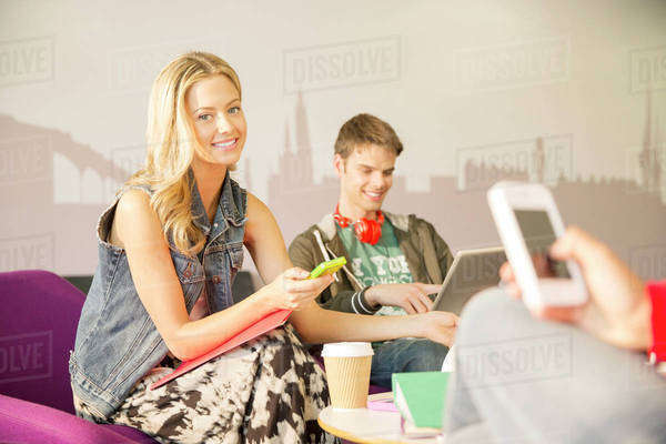 University students using technology in lounge - Royalty-free Stock ...