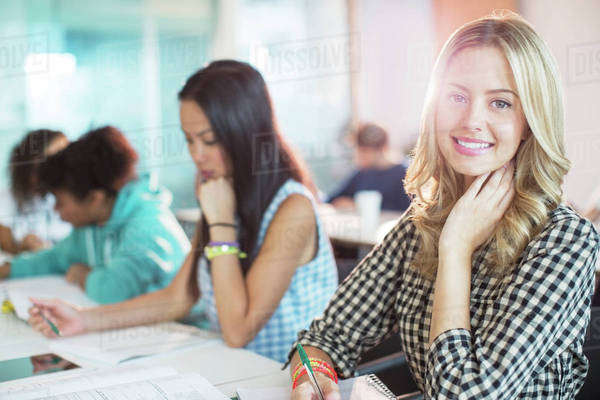 University student smiling in classroom - Royalty-free Stock Photo ...