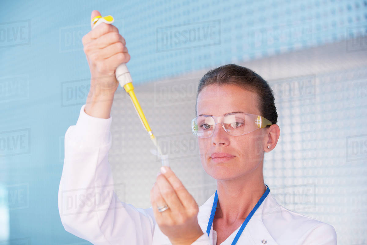 Scientist using pipette - Royalty-free Stock Photo | Dissolve