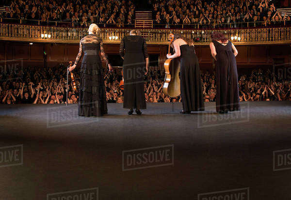 Quartet bowing on stage in theater - Stock Photo - Dissolve