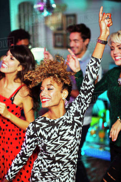 Friends dancing together at party - Royalty-free Stock Photo | Dissolve