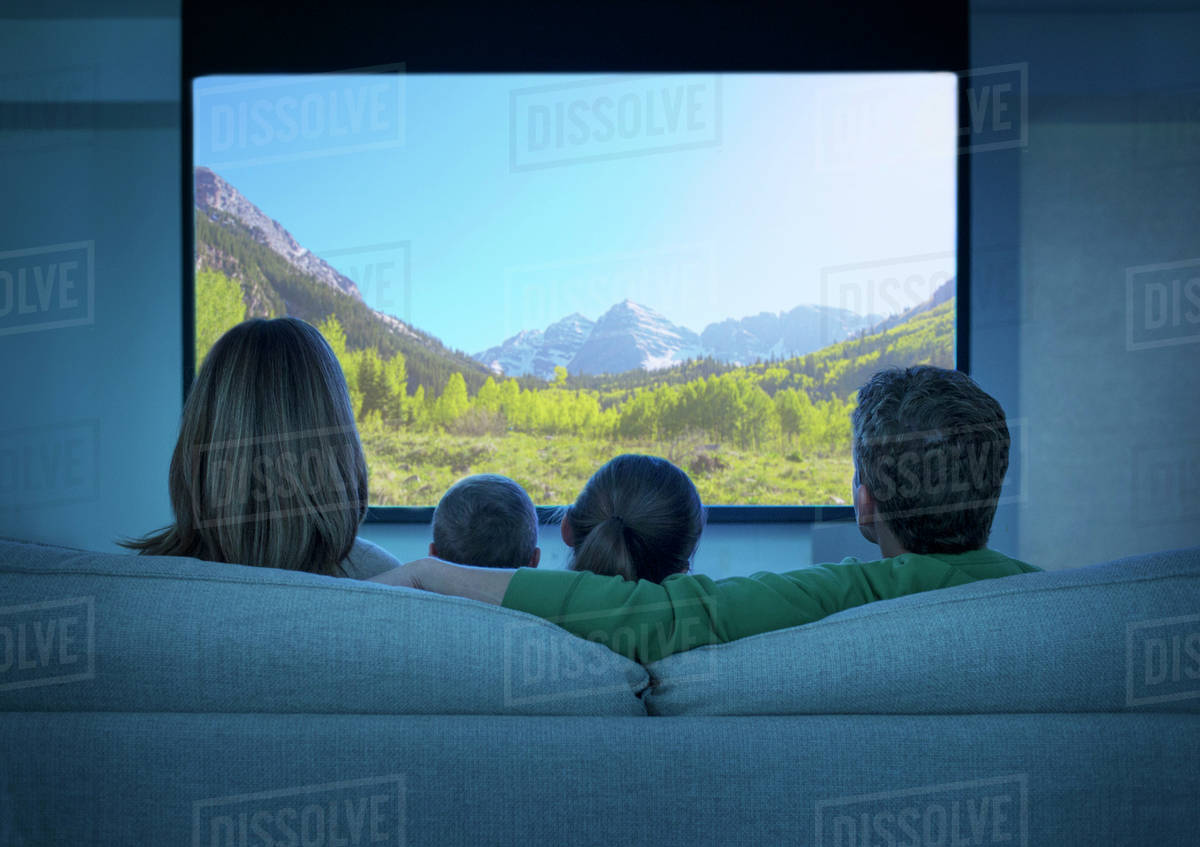 Family watching television in living room - Royalty-free Stock Photo ...