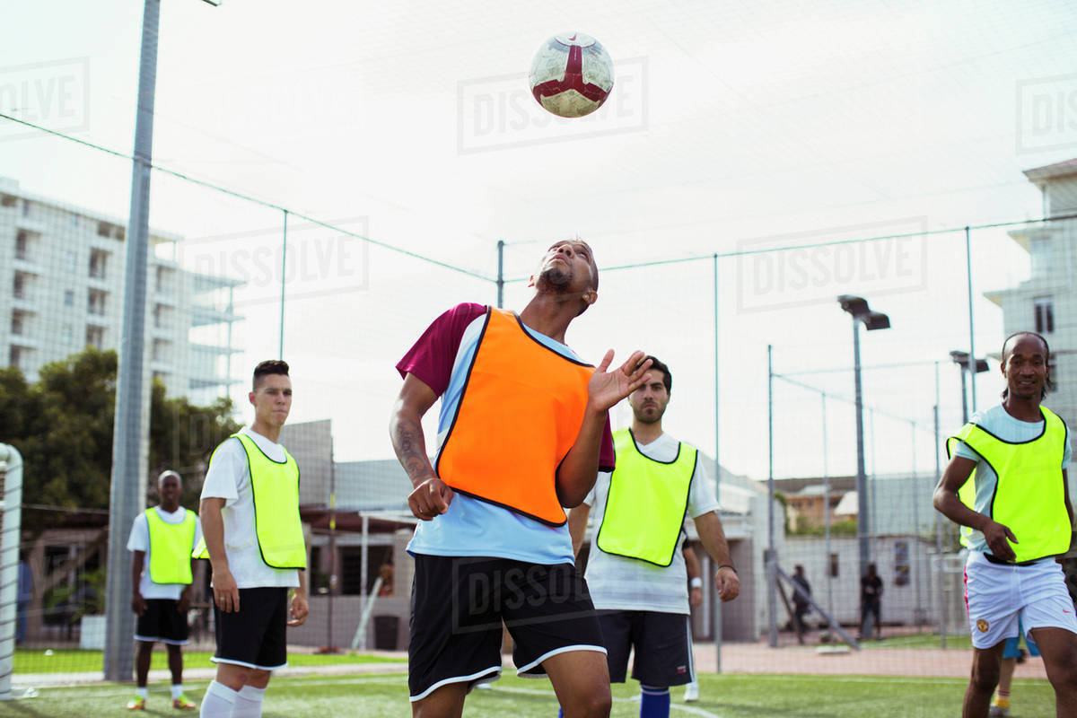 Soccer players training on field - Royalty-free Stock Photo | Dissolve