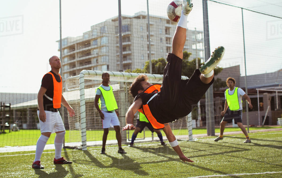 Soccer players training on field - Royalty-free Stock Photo | Dissolve