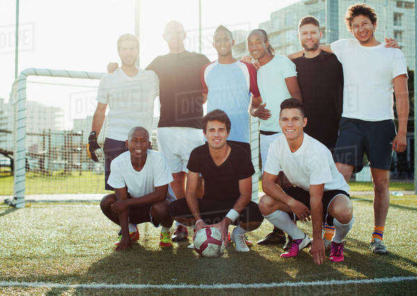 Soccer players smiling on field - Royalty-free Stock Photo | Dissolve