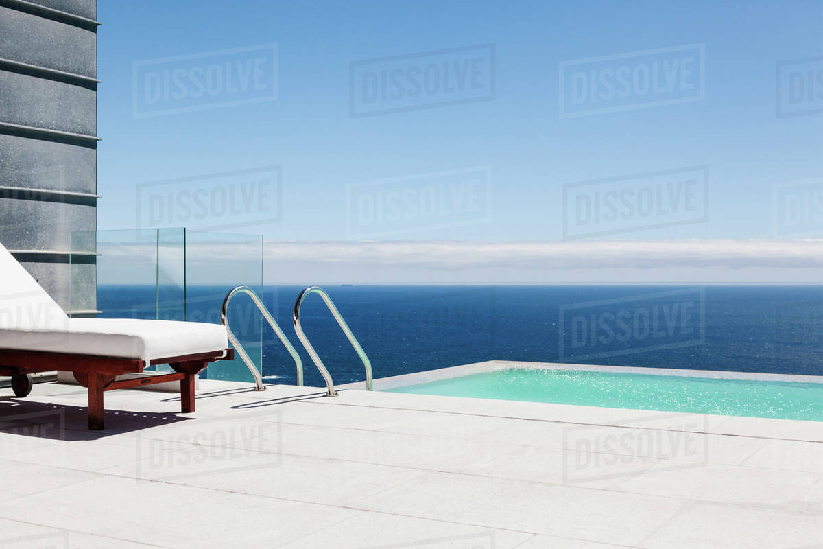Infinity pool overlooking ocean - Royalty-free Stock Photo | Dissolve