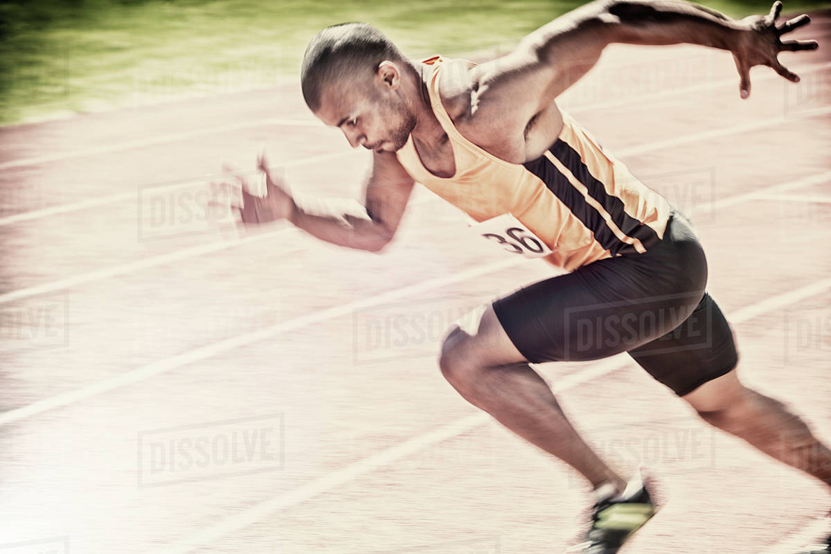 Sprinter racing on track - Royalty-free Stock Photo | Dissolve