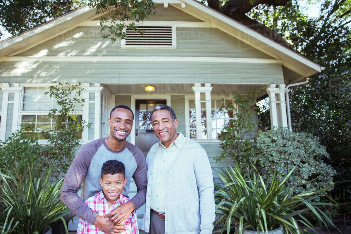 Portrait of smiling multi-generation men outside house - Royalty-free ...