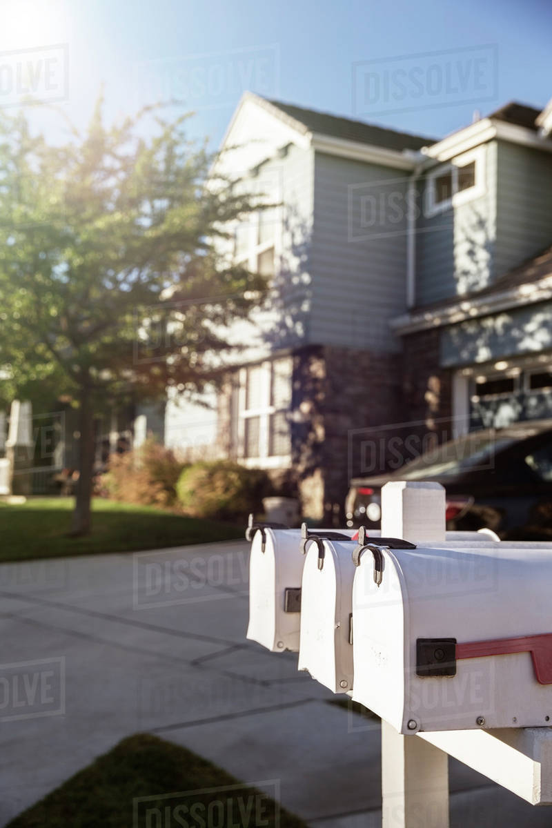 Mailboxes outside house - Stock Photo - Dissolve