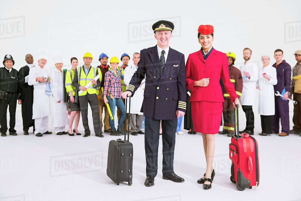 Portrait of confident pilot and flight attendant - Stock Photo - Dissolve