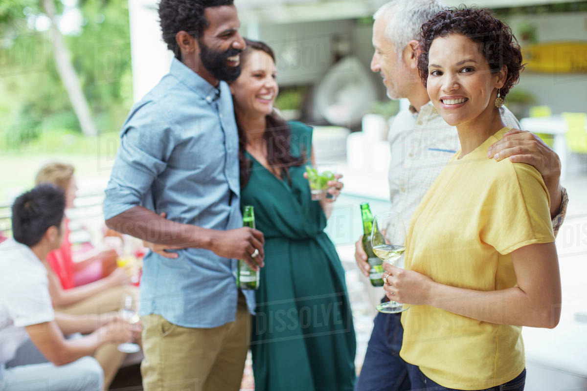 Woman smiling at party - Royalty-free Stock Photo | Dissolve