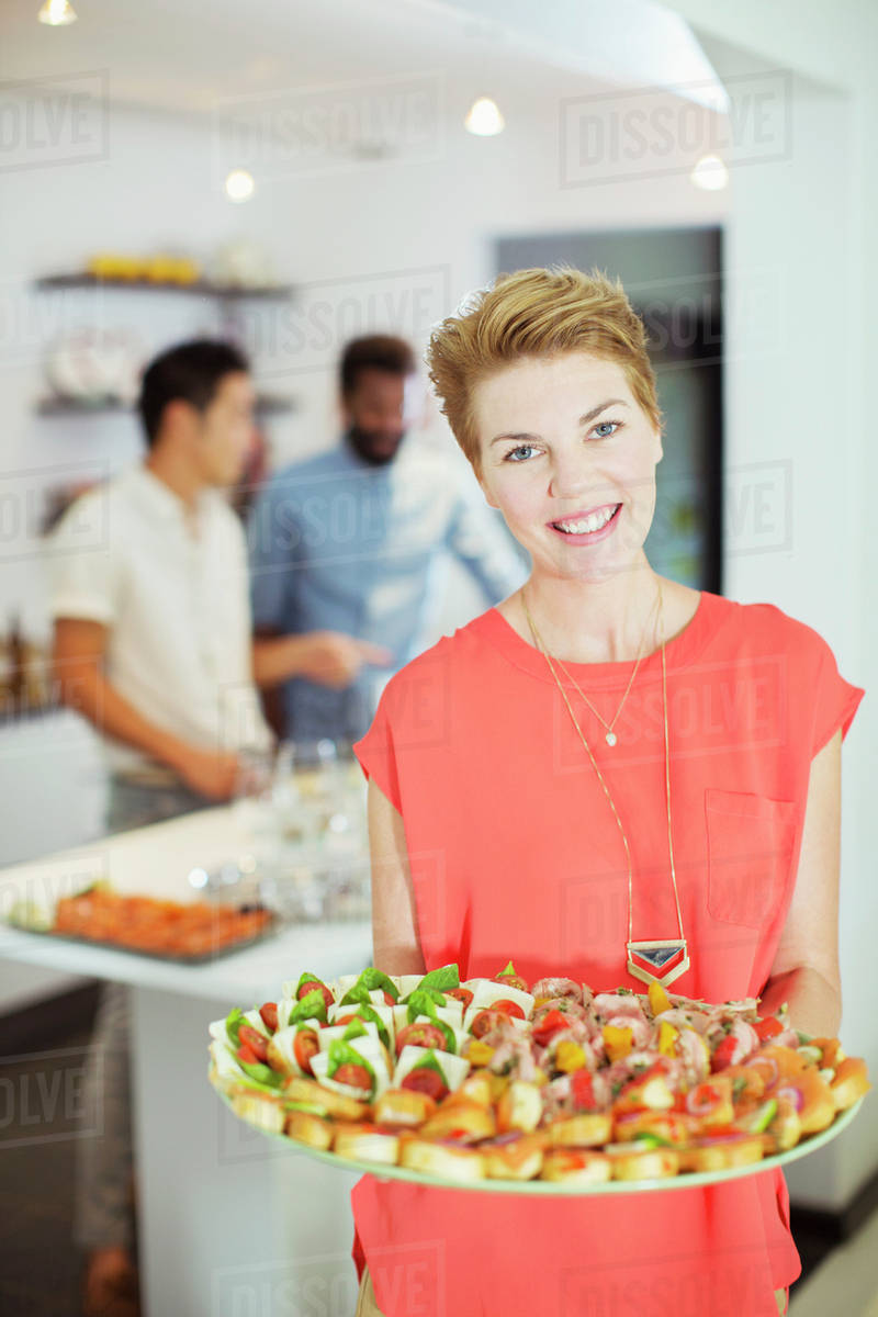 Woman Serving Food At Party Stock Photo Dissolve Woman Serving Food At Party Stock Photo Dissolve