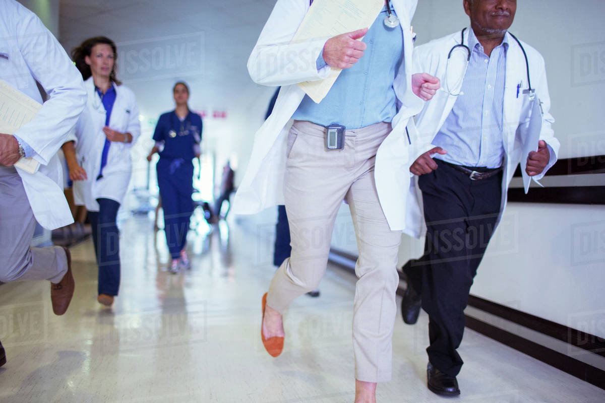 Doctors and nurses rushing in hospital hallway - Royalty-free Stock ...