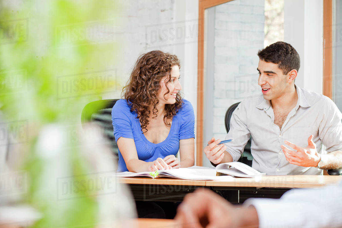 Business people talking in office - Royalty-free Stock Photo | Dissolve