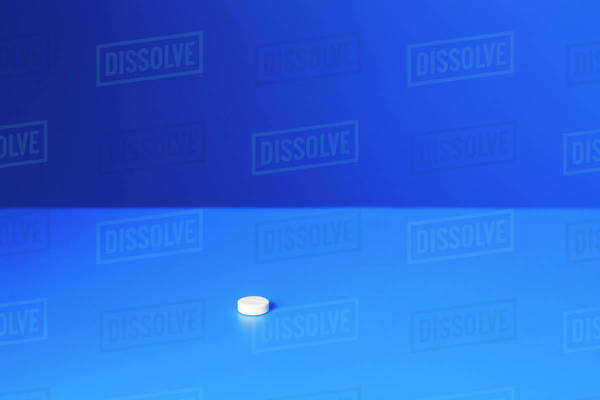 Close up of prescription pill on blue counter - Royalty-free Stock ...
