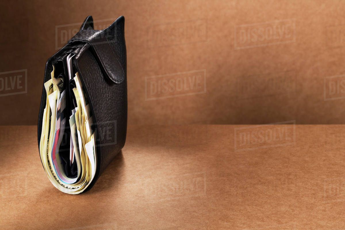 Close up of full wallet standing upright on counter - Royalty-free ...