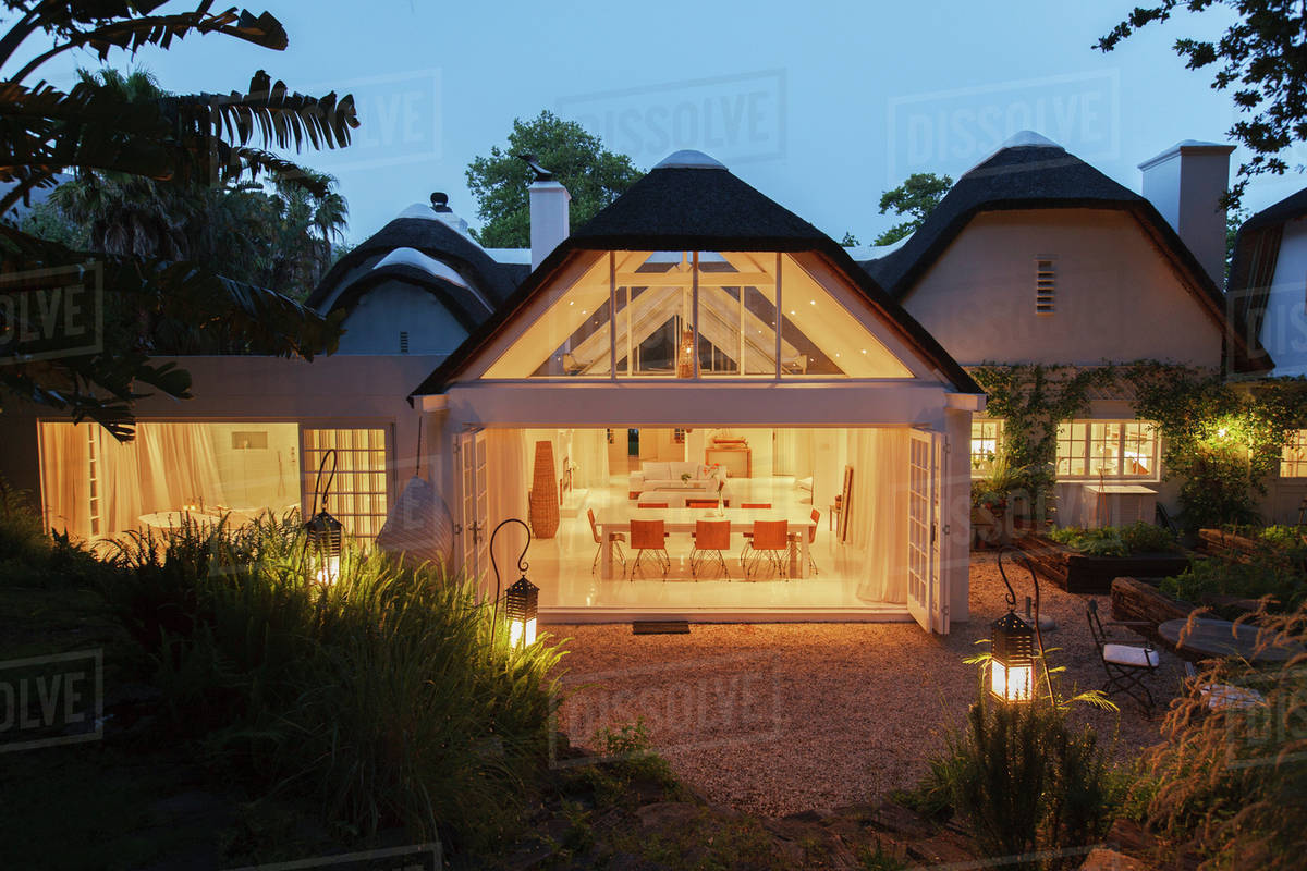 Open modern house illuminated at night - Royalty-free Stock Photo ...