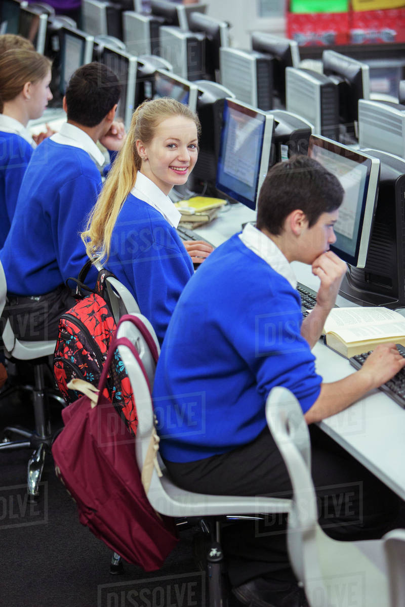 Students smiling, sitting and learning in computer room - Royalty-free ...