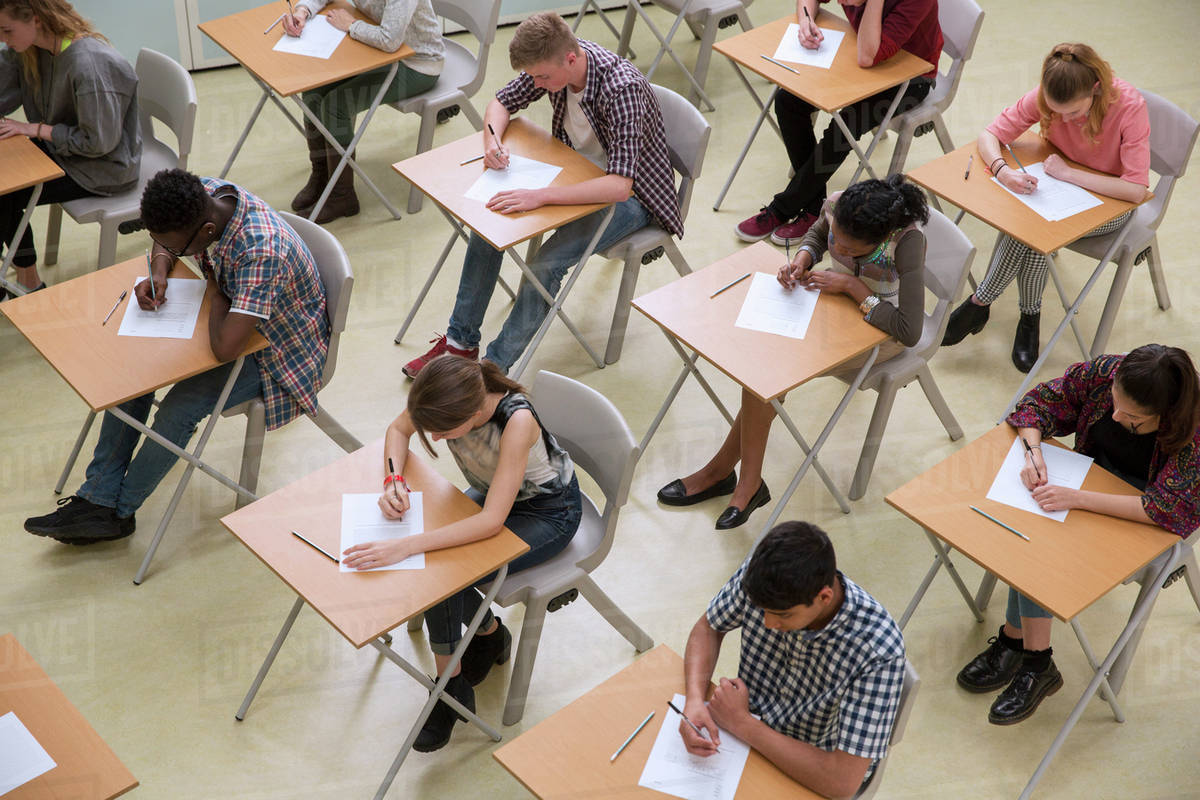 Elevated view of students writing their GCSE exam - Royalty-free Stock ...