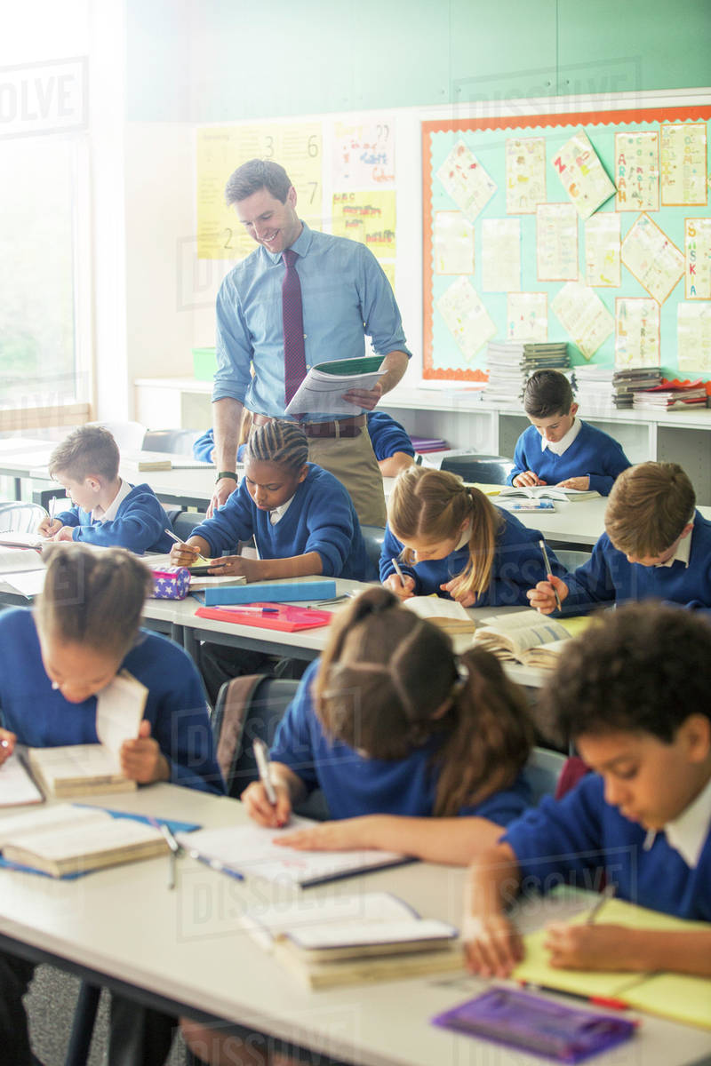 Elementary school children in classroom during lesson - Royalty-free ...