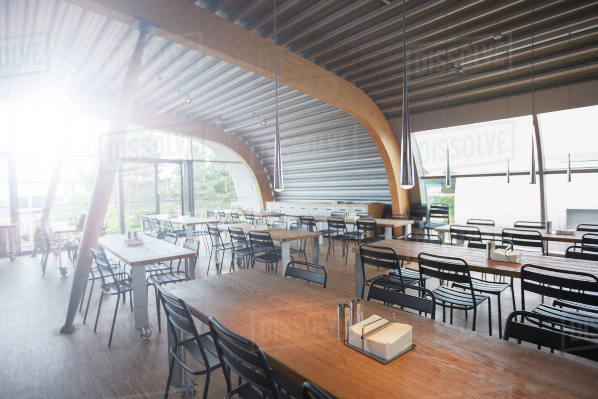 Empty tables in office cafeteria - Royalty-free Stock Photo | Dissolve