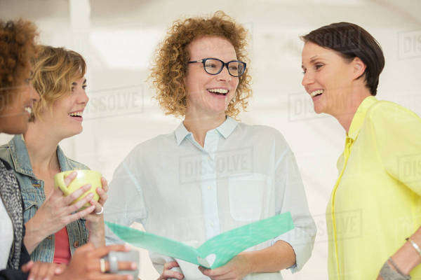 Portrait of laughing office workers - Royalty-free Stock Photo | Dissolve