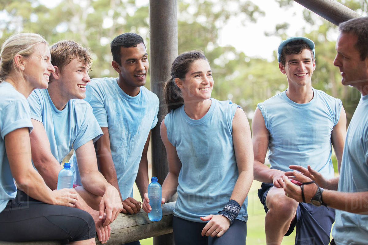 Team leader talking to teammates at boot camp - Stock Photo - Dissolve
