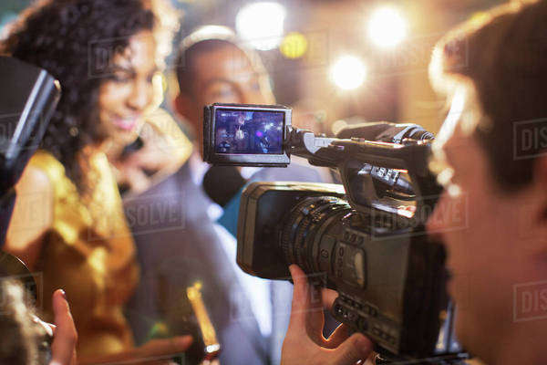 Close up of paparazzi filming celebrity couple at event - Royalty-free ...