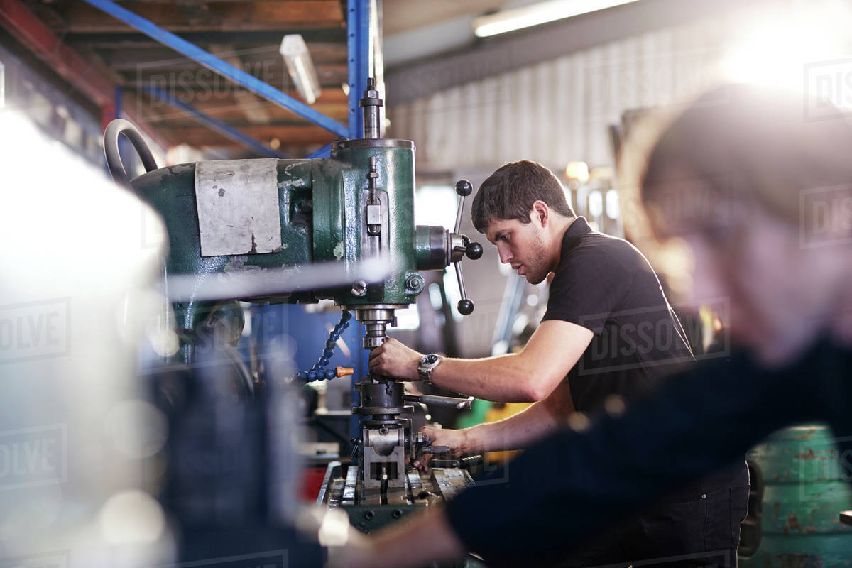 Mechanics using machinery in auto repair shop - Royalty-free Stock ...