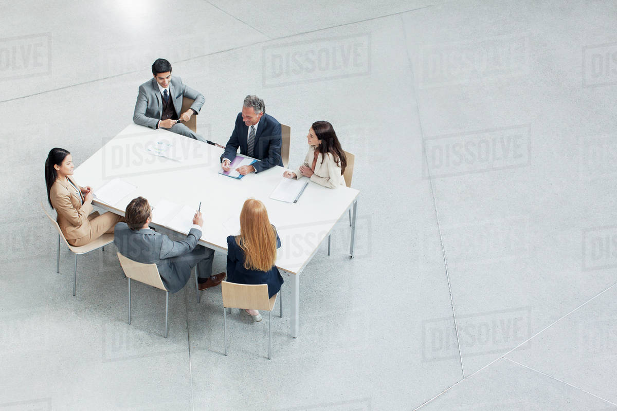 Business people meeting at table - Royalty-free Stock Photo | Dissolve
