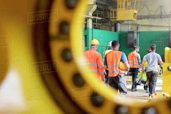 Steel workers walking in factory - Royalty-free Stock Photo | Dissolve