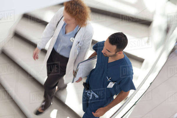 Doctor and nurse walking on hospital steps - Royalty-free Stock Photo ...