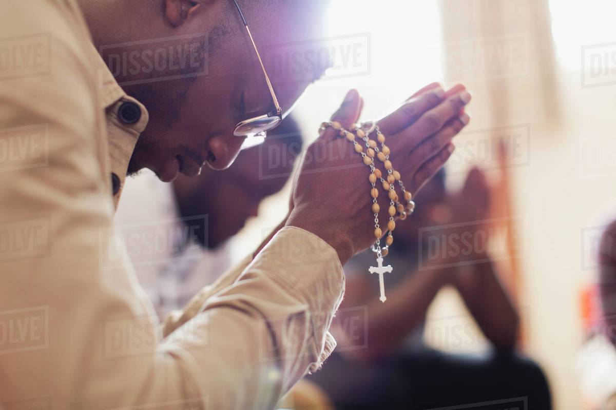 Man praying with rosary in prayer group - Royalty-free Stock Photo ...
