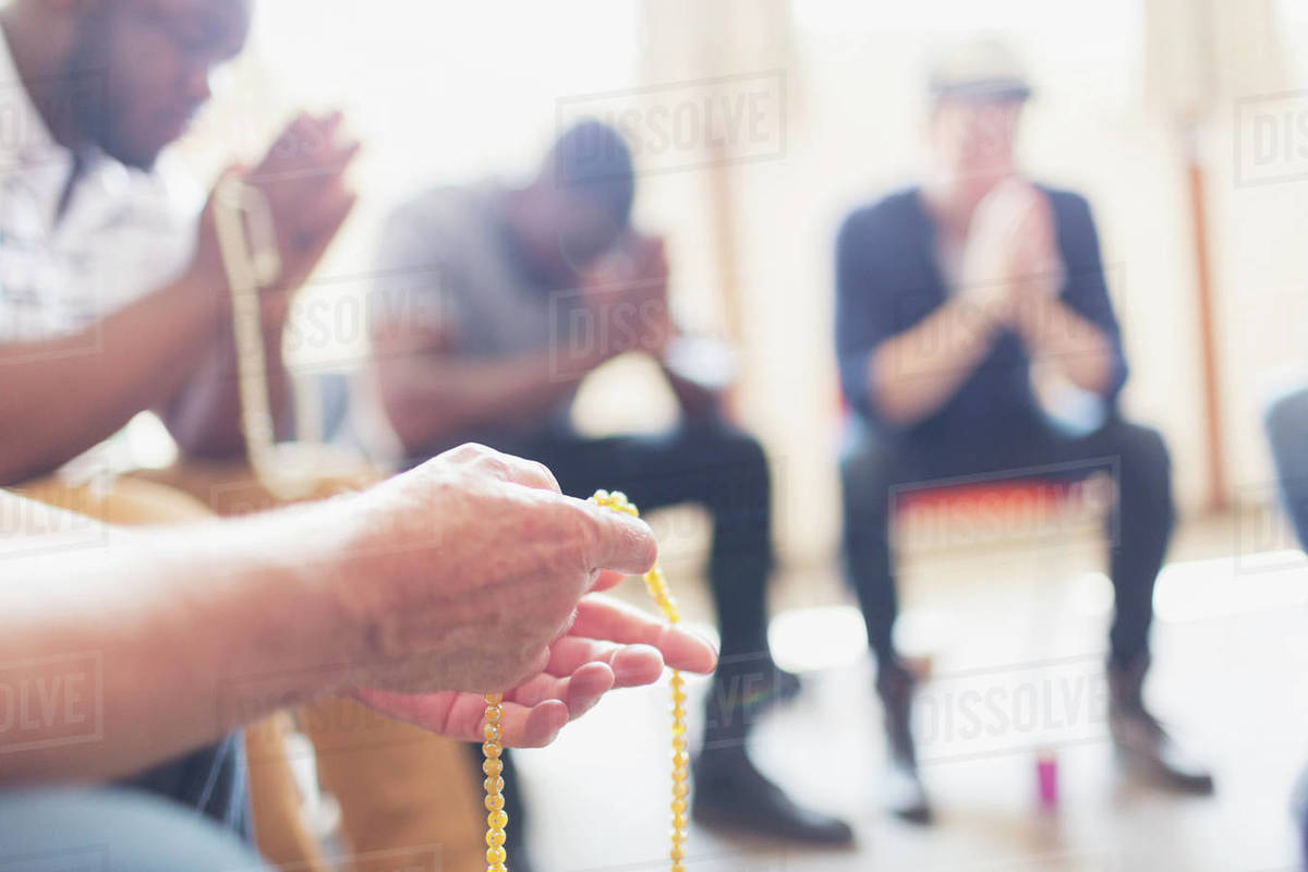 Men praying with rosaries in prayer group - Royalty-free Stock Photo ...