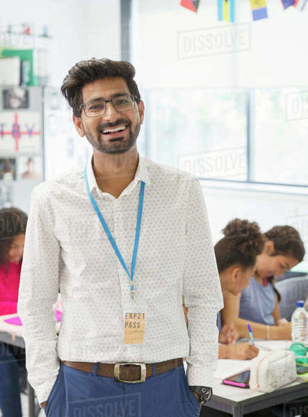 Portrait happy male teacher in classroom - Royalty-free Stock Photo ...