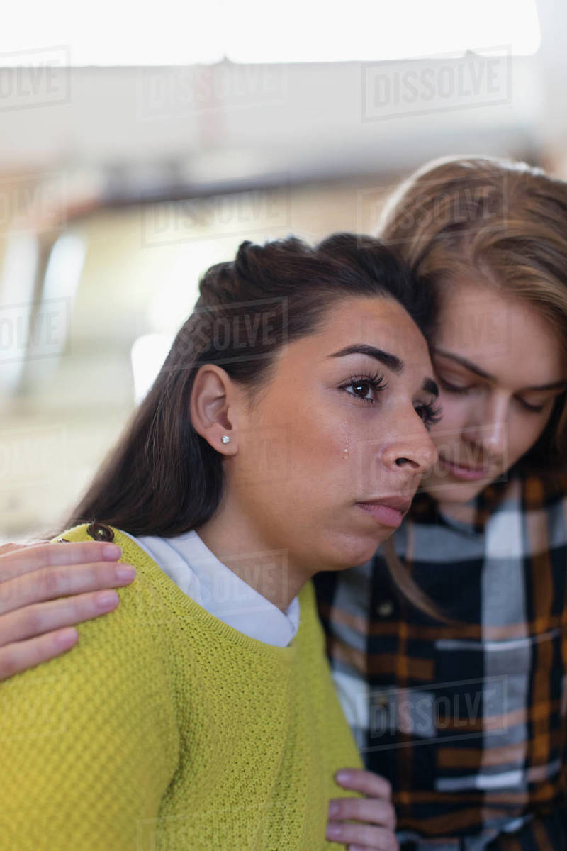 Young woman consoling crying friend - Royalty-free Stock Photo | Dissolve