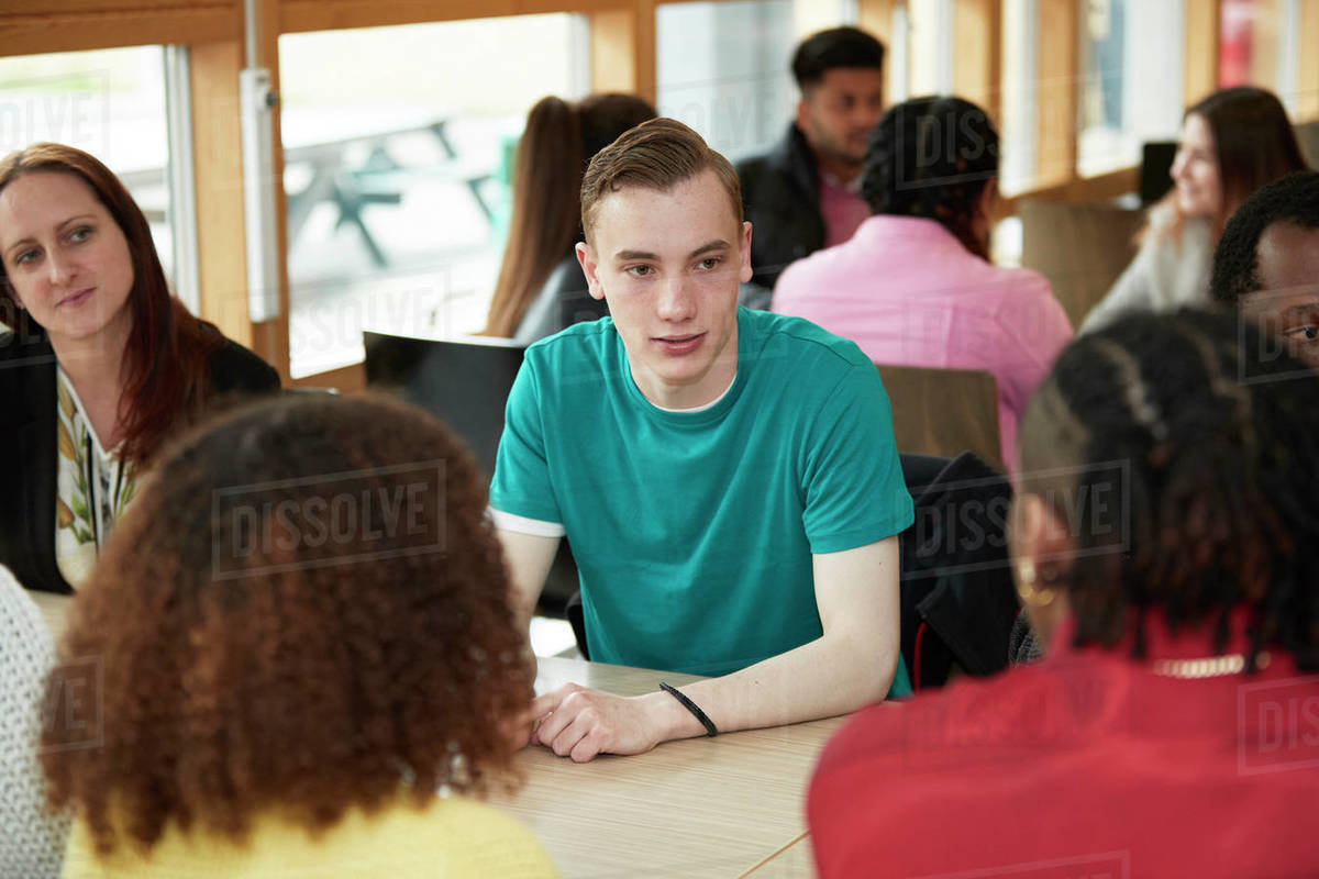 College students talking in classroom - Royalty-free Stock Photo | Dissolve
