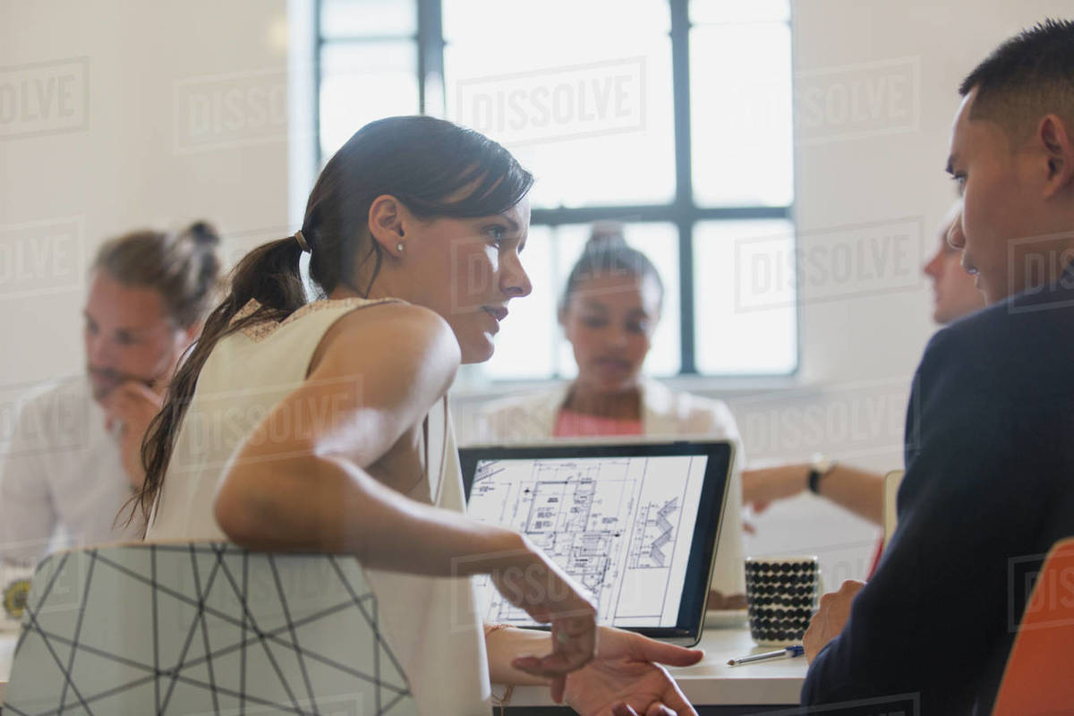 Focused architects talking in conference room meeting - Stock Photo ...