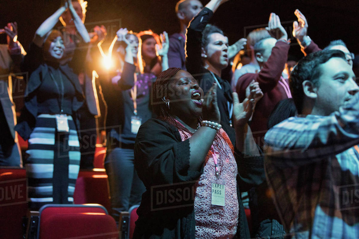 Audience clapping and cheering in dark concert hall - Royalty-free ...