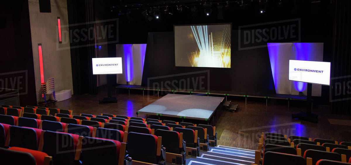 Projection screens and seats in empty conference auditorium - Stock ...