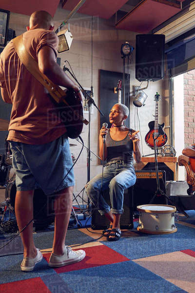 Musicians practicing in recording studio - Stock Photo - Dissolve