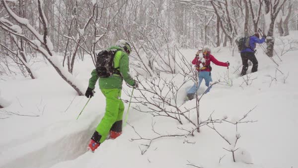 Slow motion of skiers trudging through snow - Stock Video Footage ...