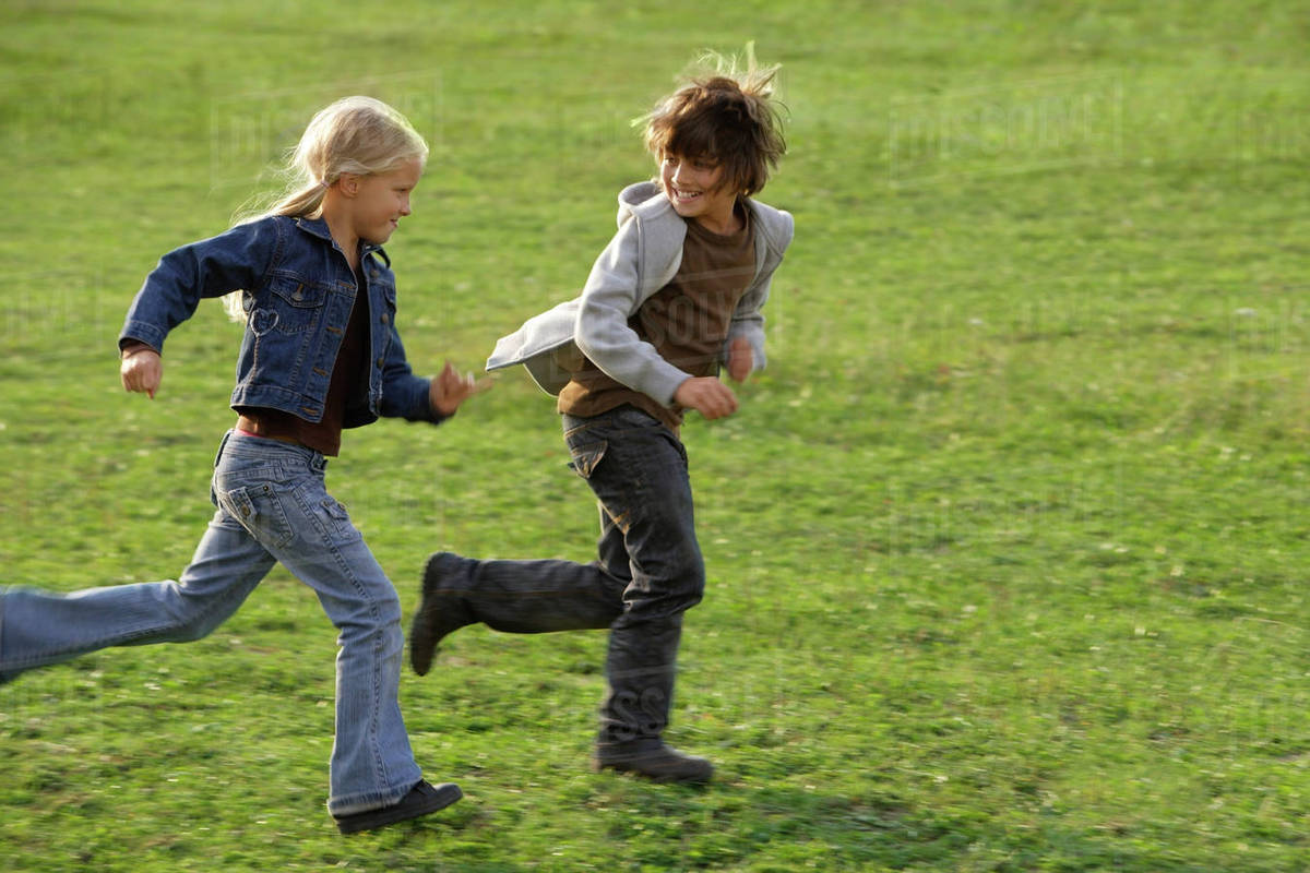 Boy and girl running - Stock Photo - Dissolve