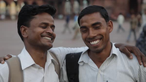 Two Men Smiling / India - Stock Video Footage - Dissolve