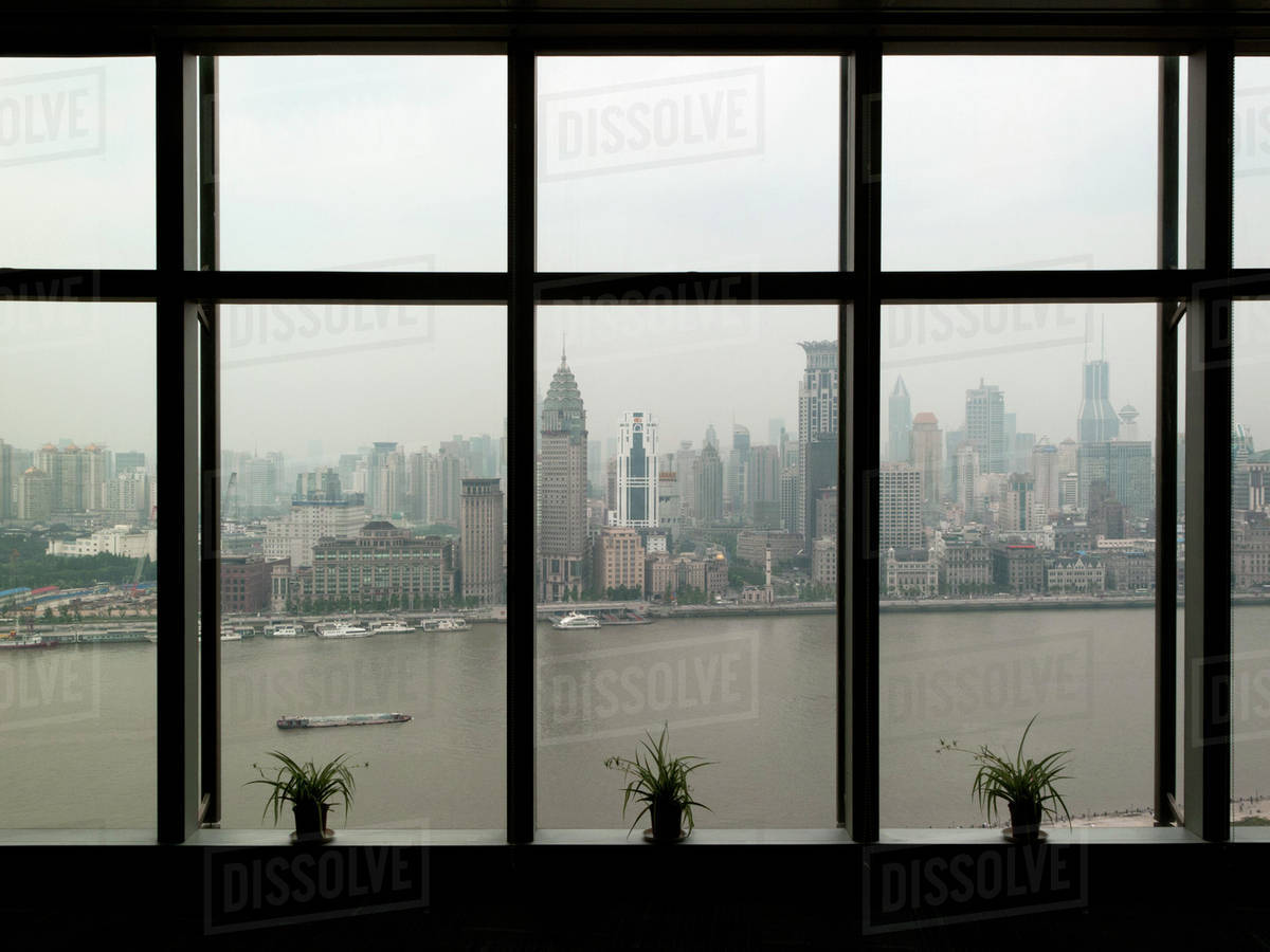 Shanghai skyline seen through window - Stock Photo - Dissolve